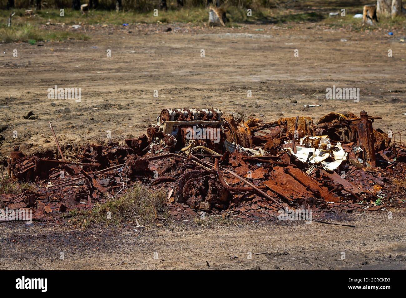 The rusted remains of a burnt out car chassis left abandoned on tidal ...