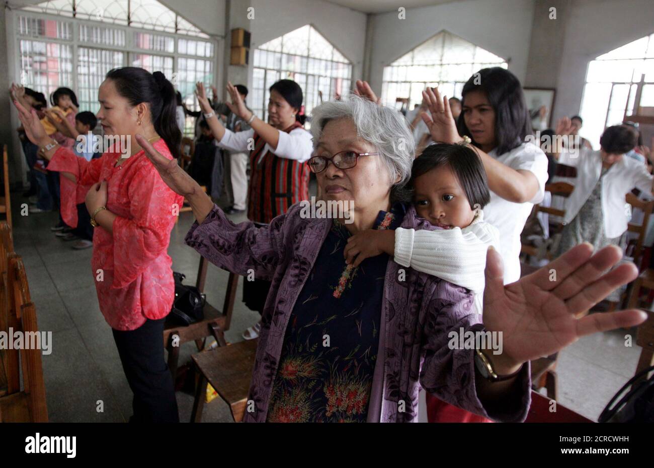 Filipino Praying In Church