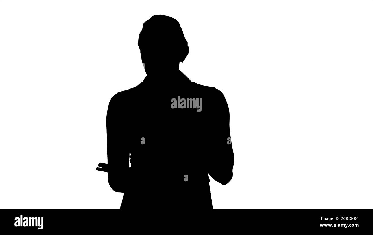 Silhouette Woman in formal clothes opens notebooks and looks ins Stock ...