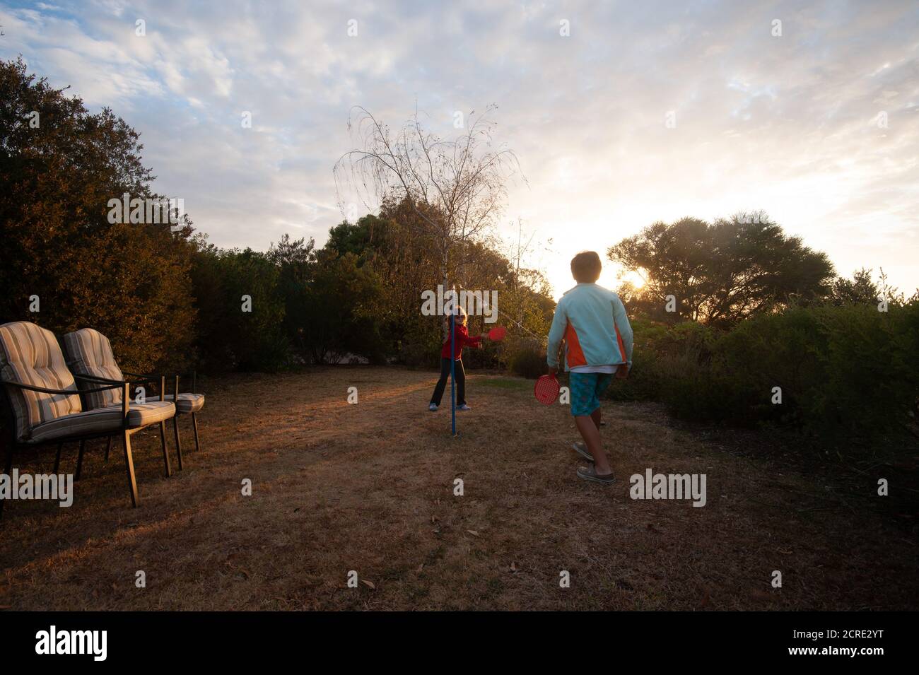 kids playing outdoor at sunset outside Stock Photo - Alamy