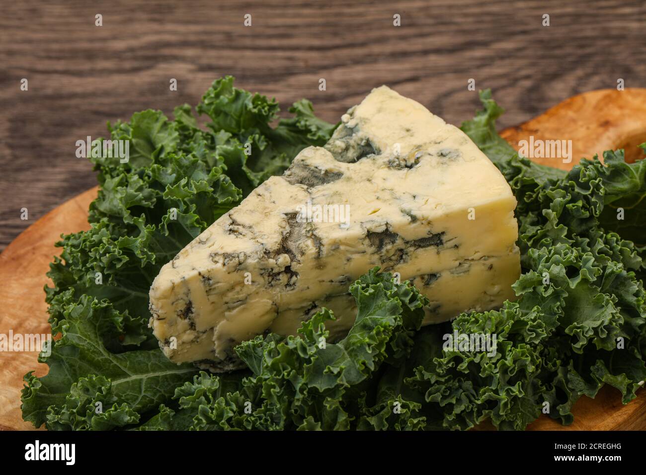 Dairy Blue cheese triangle with mold Stock Photo - Alamy