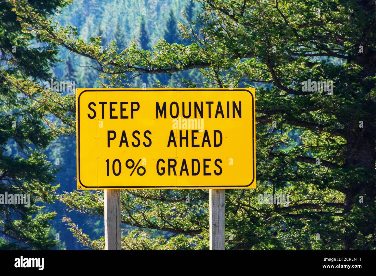 Steep mountain pass traffic warning sign advising motorists of a steep ...