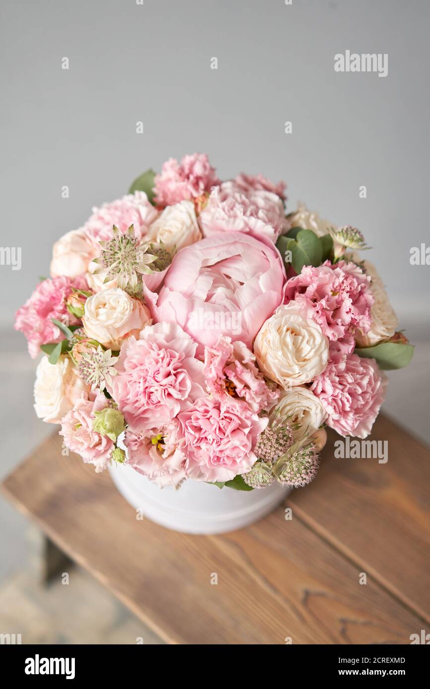 Beautiful spring bouquet in round box. Arrangement with various flowers ...
