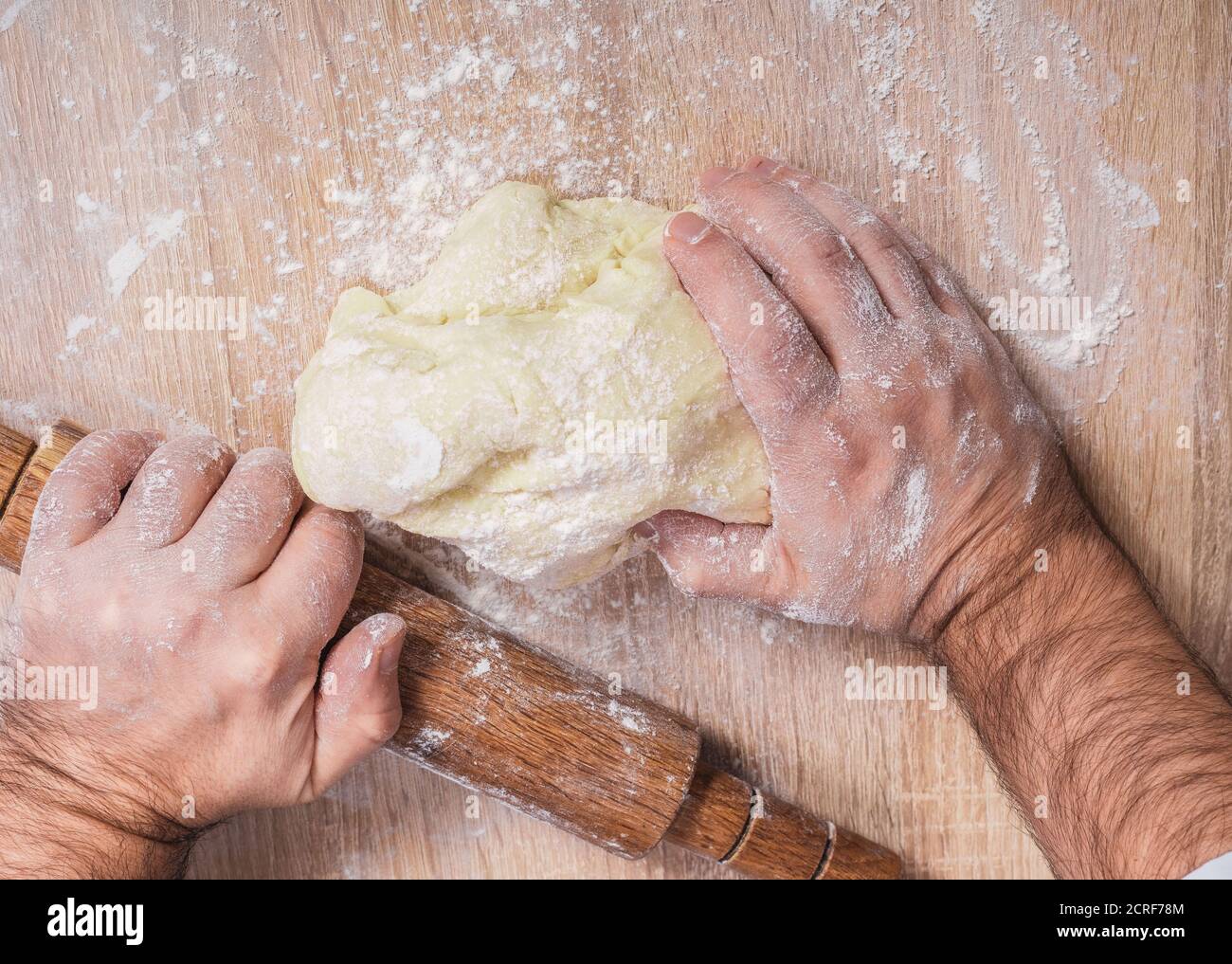 Man kneads dough flour hi-res stock photography and images - Alamy
