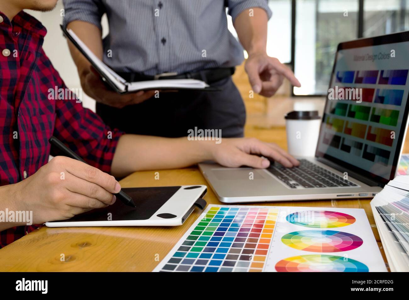 Graphic designers present colors from the color palette to their ...