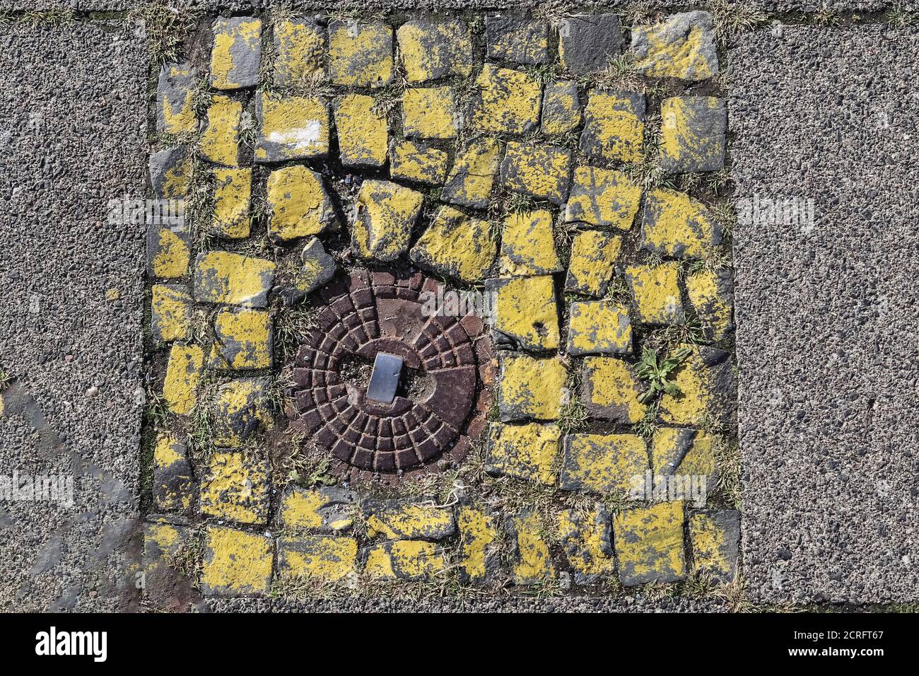 Top view of a metal round sewer hatch on a stone pavement Stock Photo ...