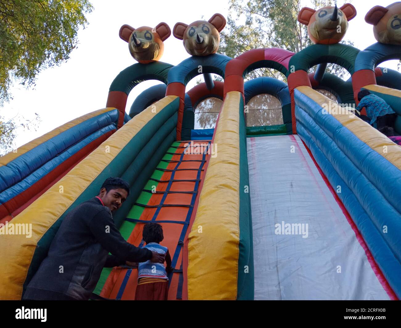 DISTRICT KATNI, INDIA - FEBRUARY 02, 2020: Indian village kid climbing ...