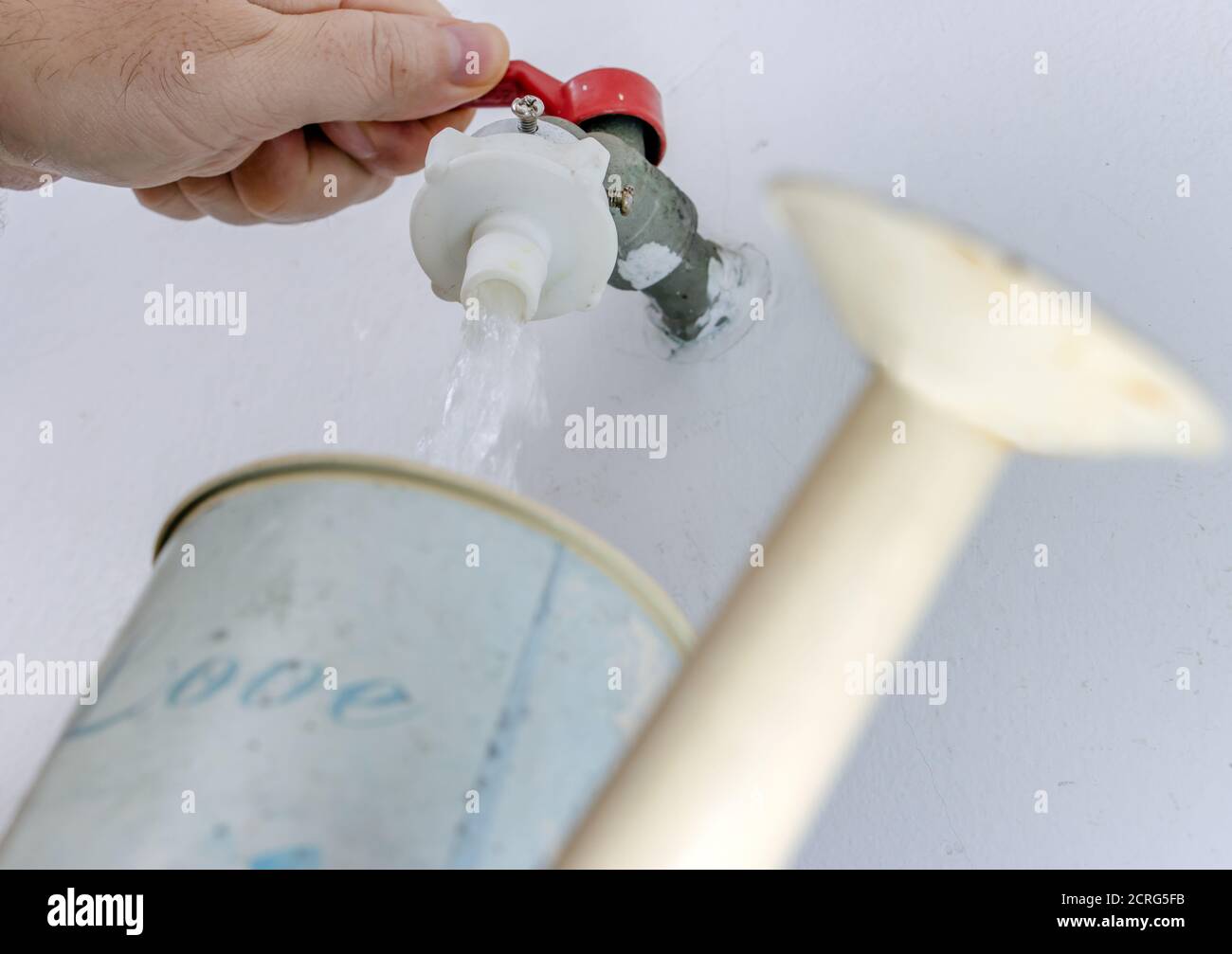 Water tap watering can hi-res stock photography and images - Alamy
