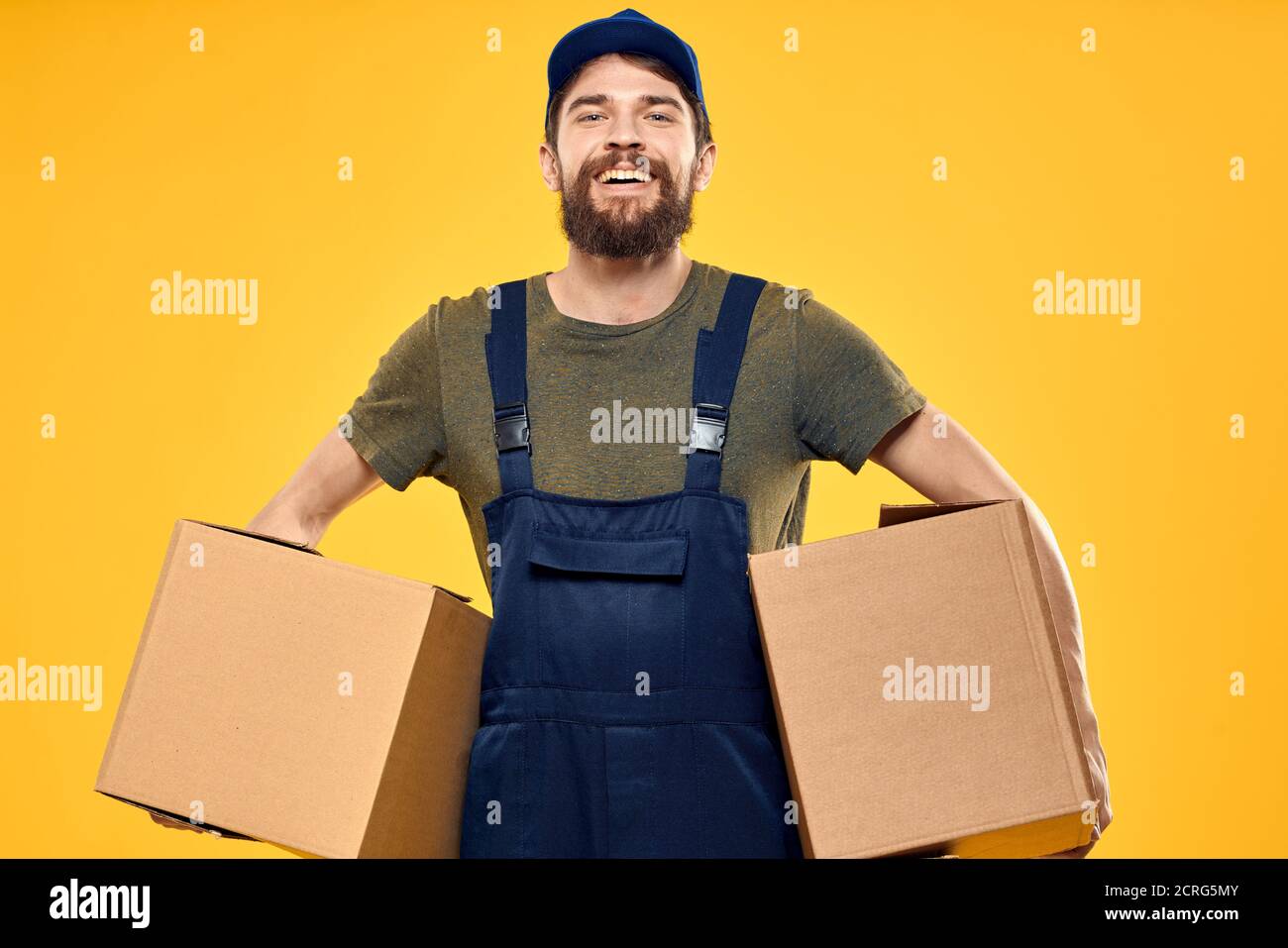 working man with box in hands delivery loading transportation service ...