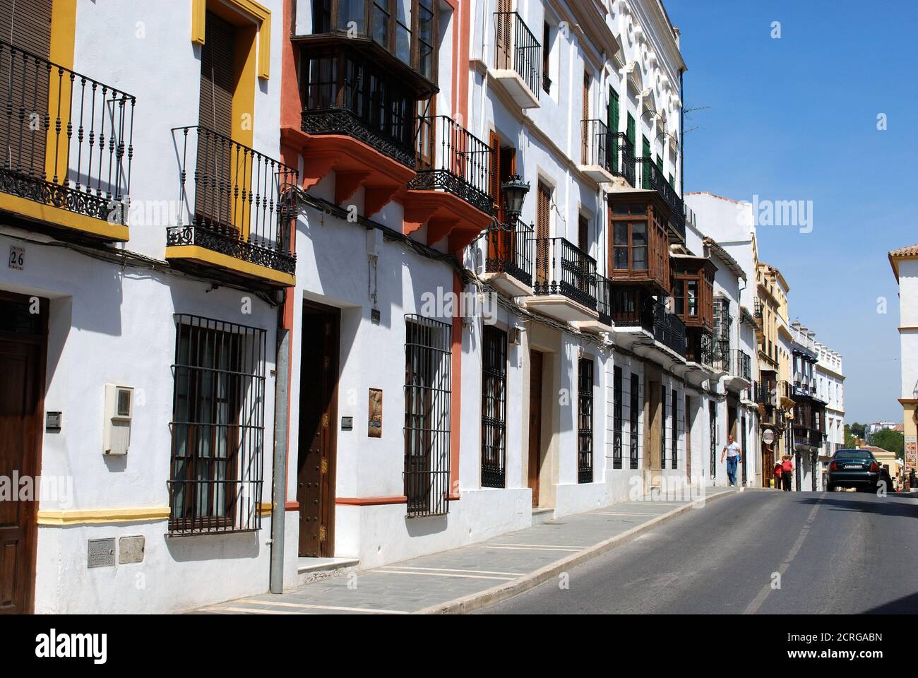 View along a traditional Spanish town centre street with pretty ...