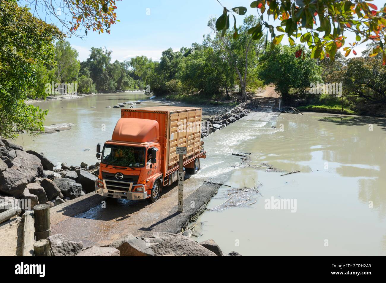 Red truck driving through the dangerous tidal crossing of the East ...