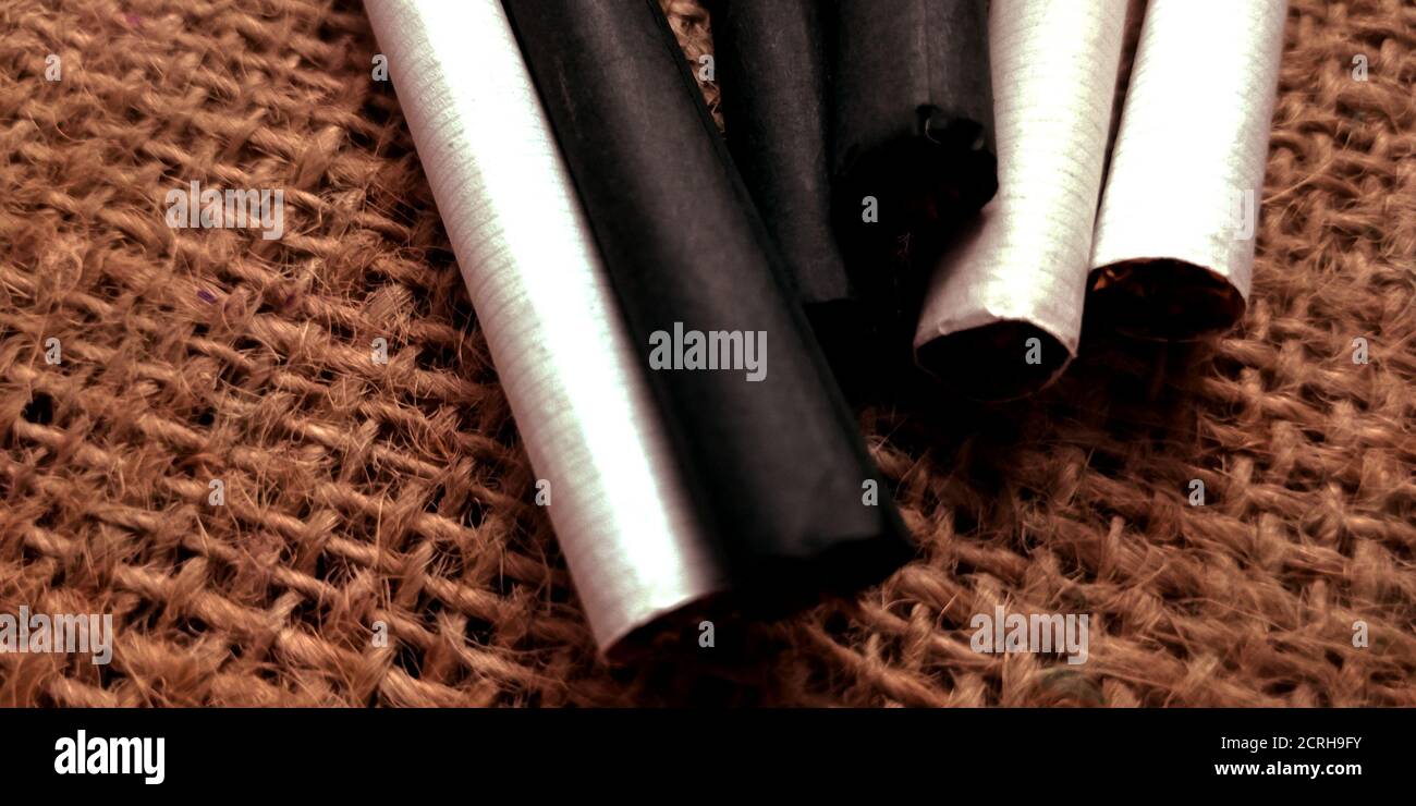Black and white cigarette on brown sack mat background, pack of ...