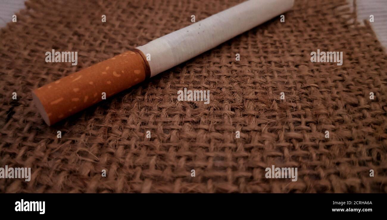 white long cigarette on brown sack mat background, pack of cigarettes ...