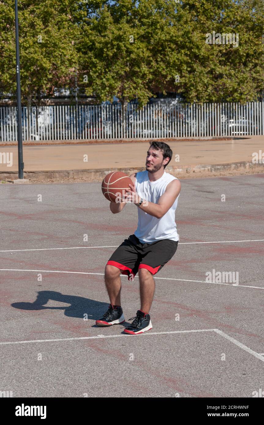 Closeup of an attractive in good shape guy playing basketball Stock ...