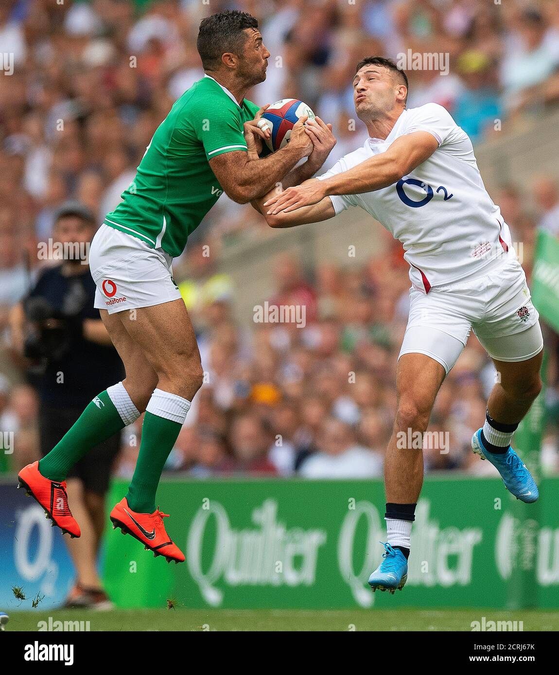 England's Jonny May battles for an aerial ball with Rob Kearney PHOTO ...
