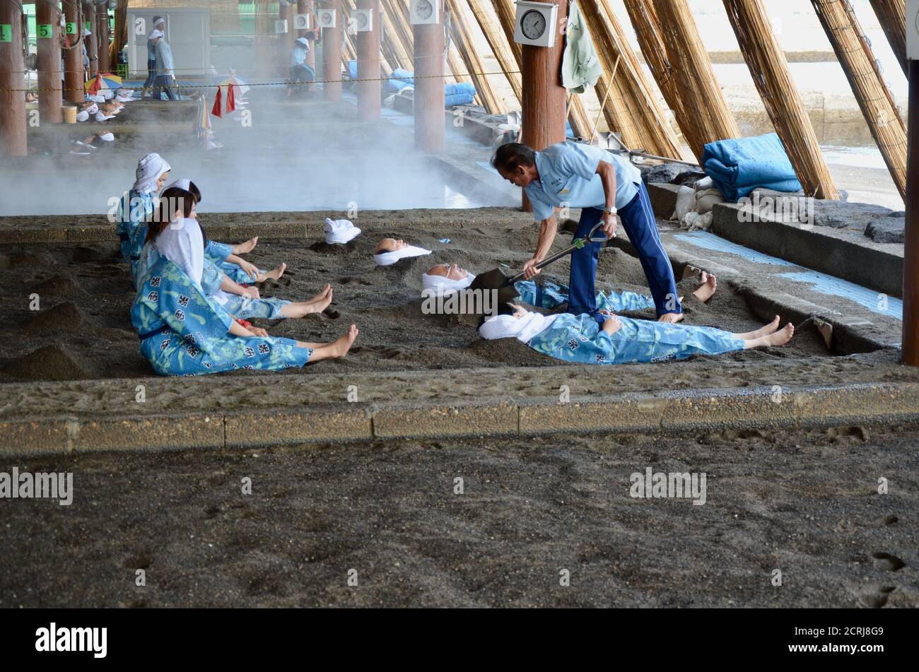 Bath of hot sand on the beach of the Ibusuki Sunamushi Onsen Stock ...