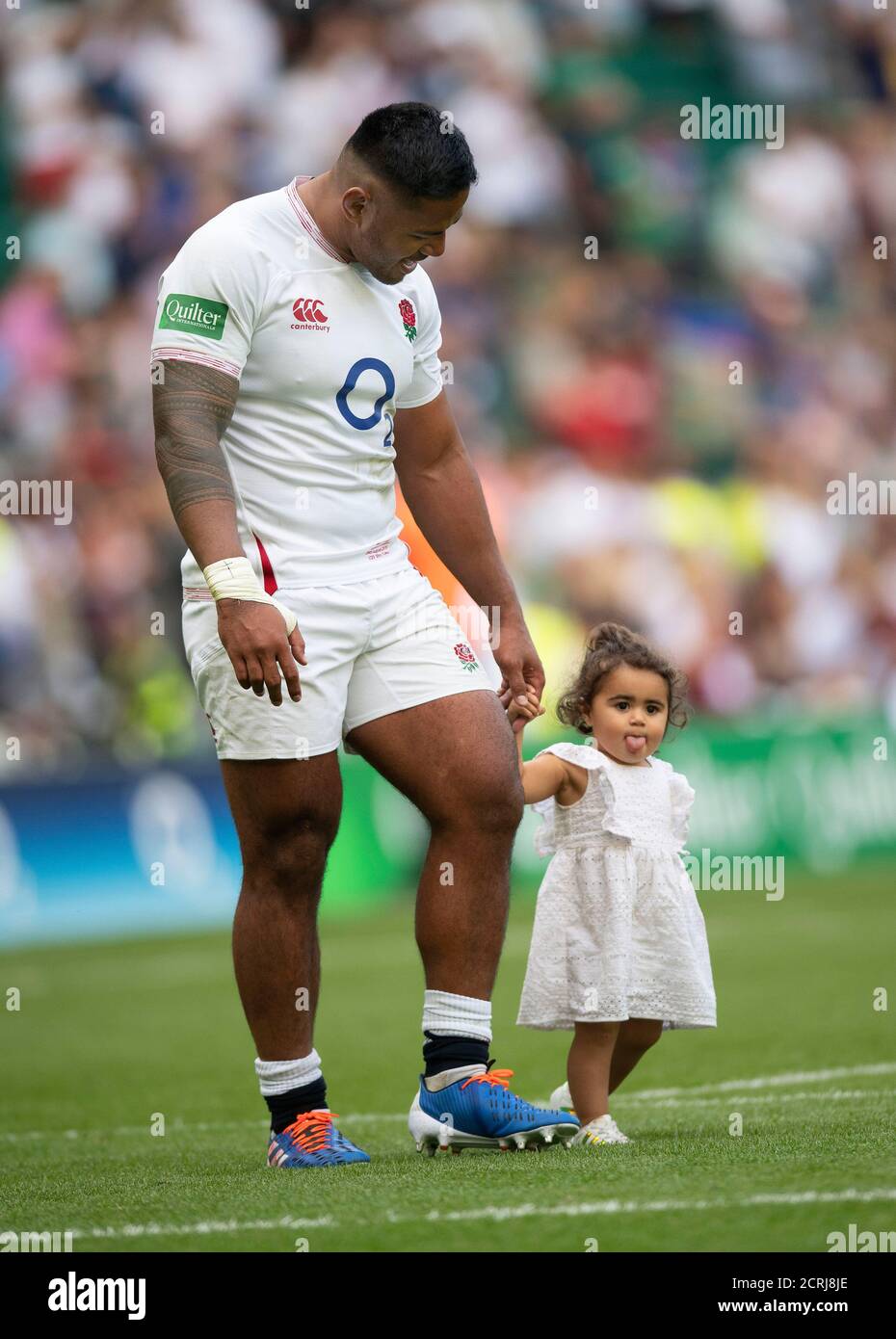 England's Manu Tuilagi walks around the pitch after the match saluting ...