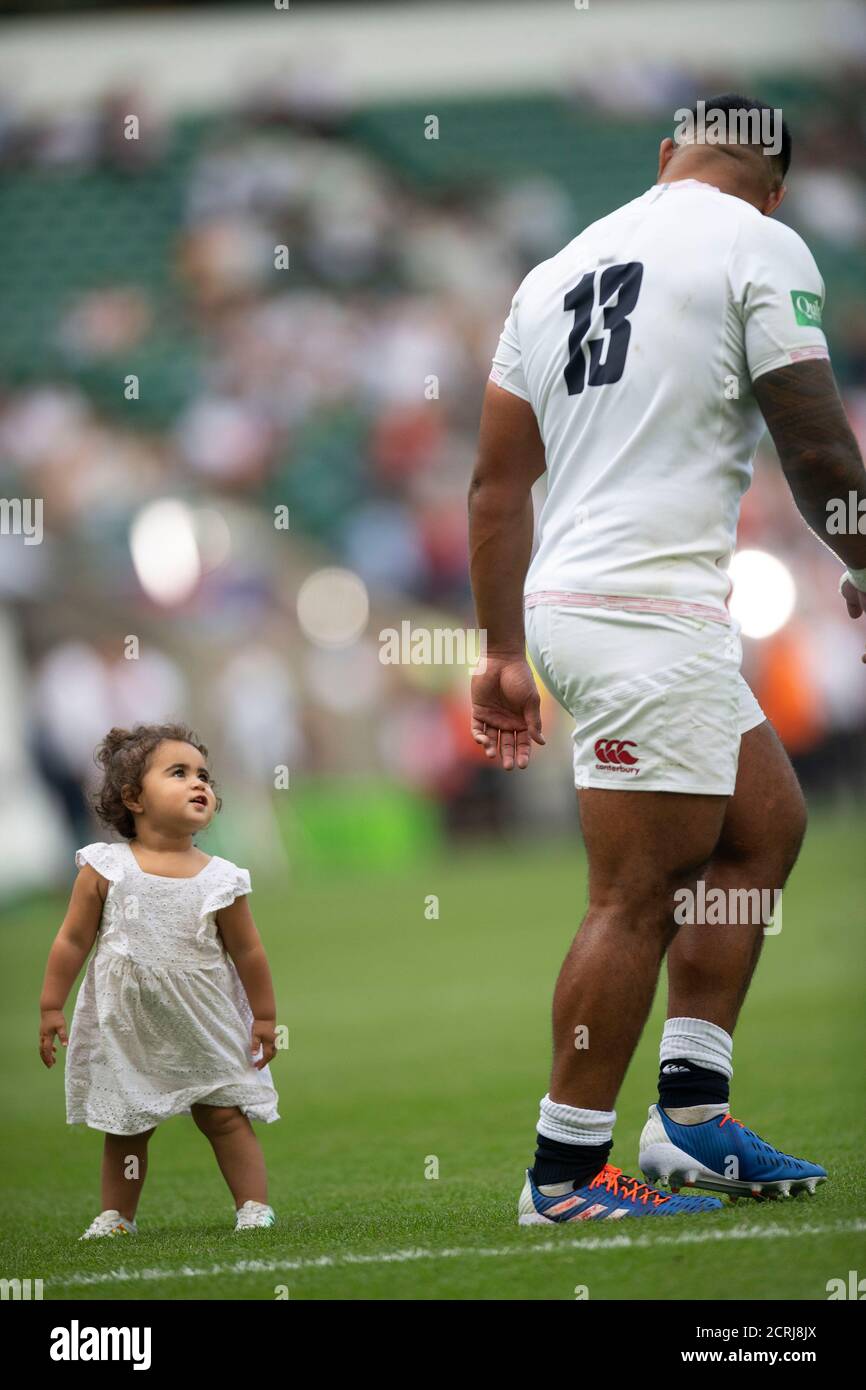 England's Manu Tuilagi walks around the pitch after the match with his ...