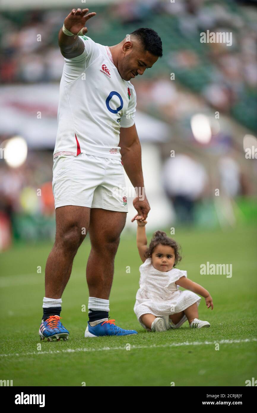 England's Manu Tuilagi walks around the pitch after the match with his ...