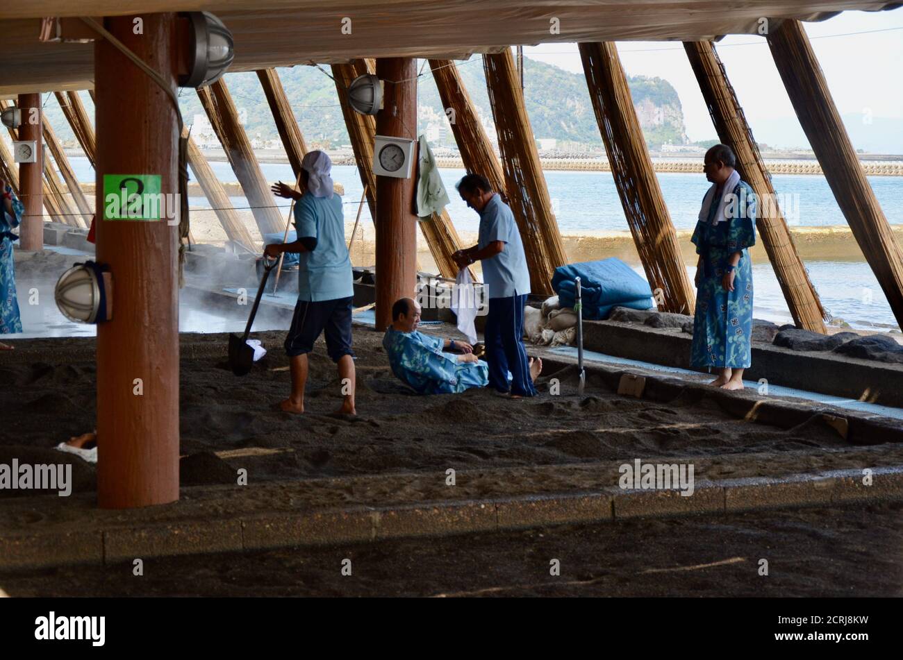 Bath of hot sand on the beach of the Ibusuki Sunamushi Onsen Stock ...