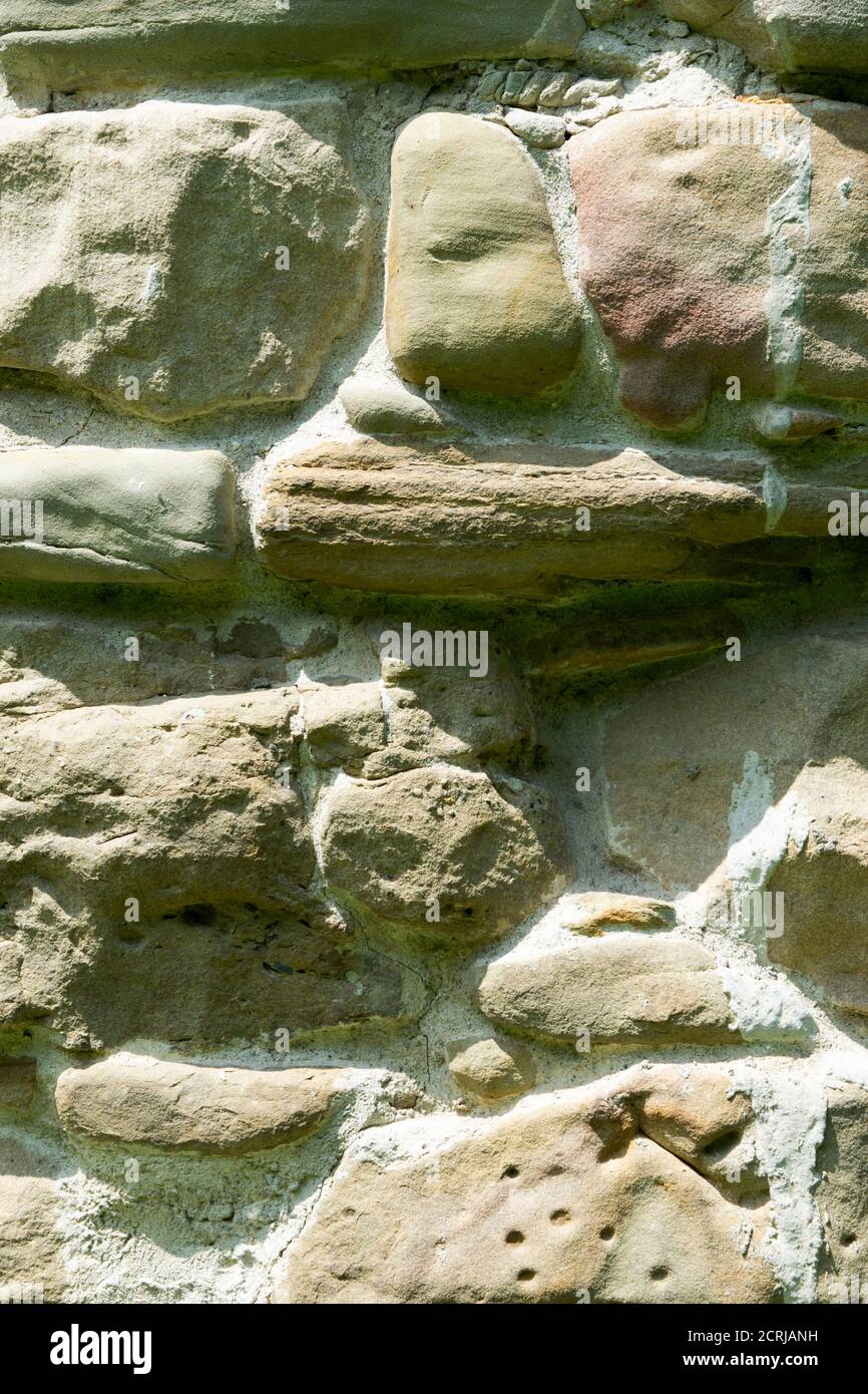 texture of masonry, the fragment of a stone wall of an ancient temple ...