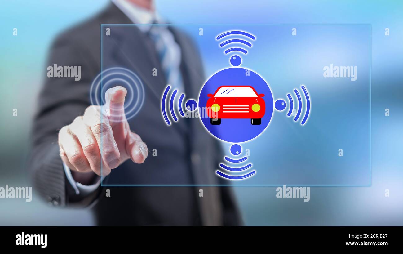 Man touching a smart car concept on a touch screen with his fingers ...