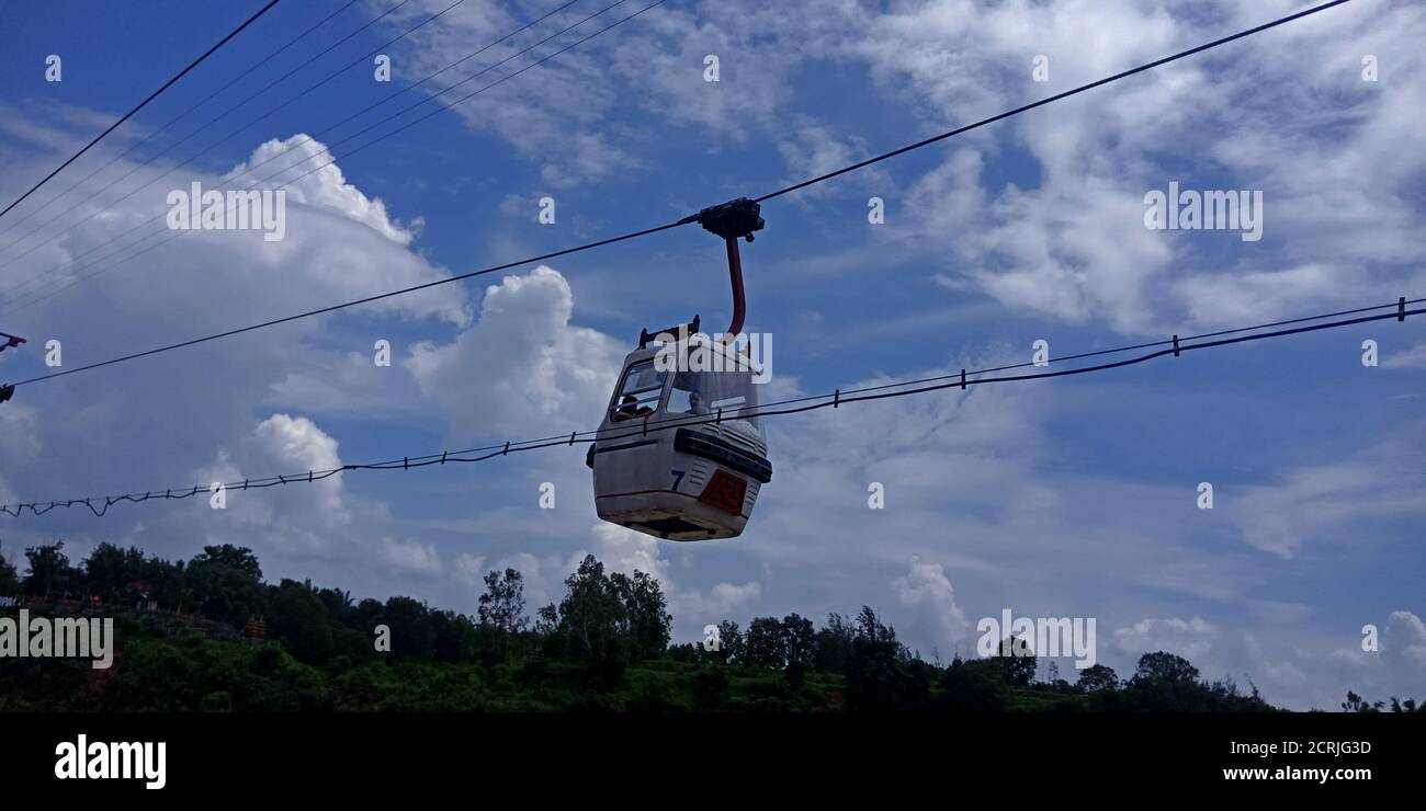 Ropeway Trolly presentation on river side hill station in blue sky ...