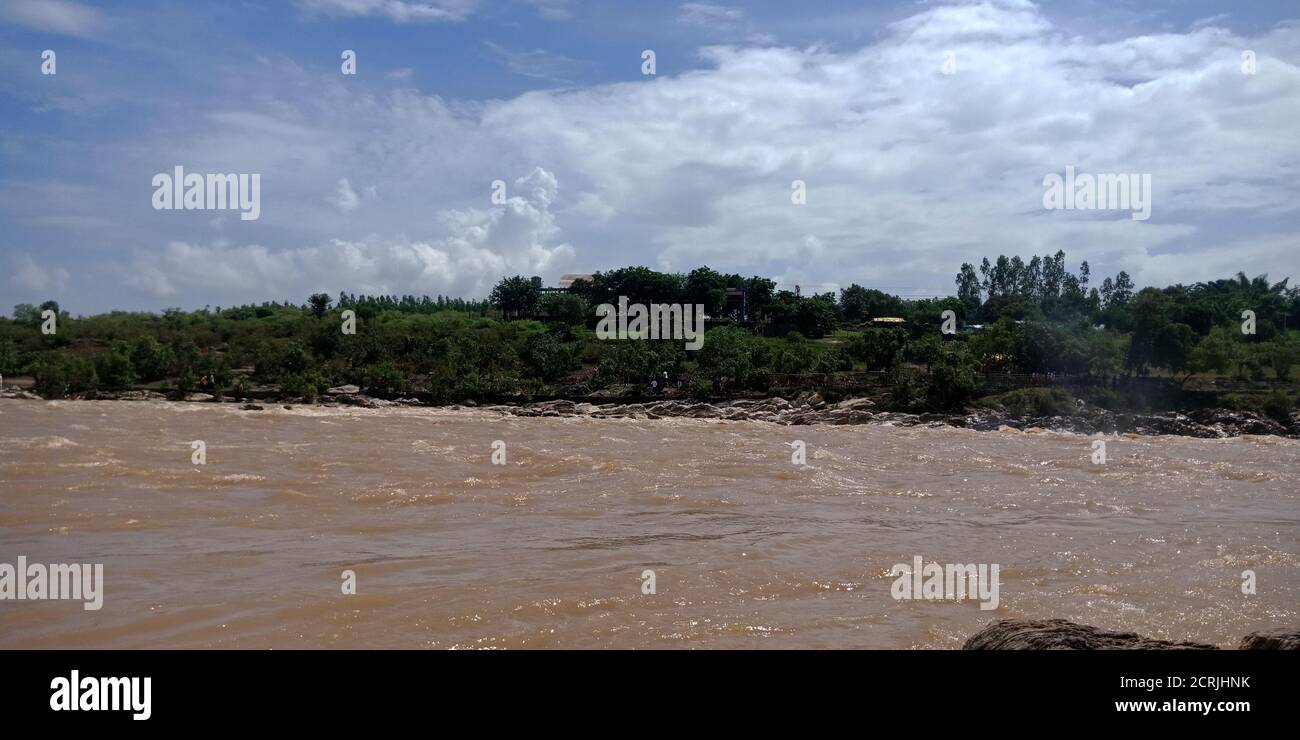 Heavy water flowing river picture during flood time on rain season ...