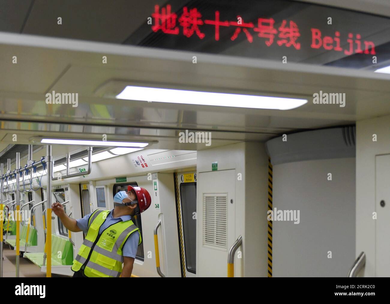 Beijing, China. 20th Sep, 2020. A staff member examines a train car of ...