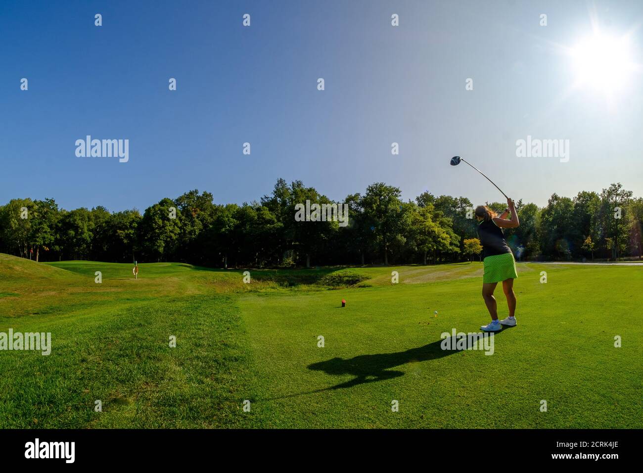 Female golfer driving golf ball hi-res stock photography and images - Alamy