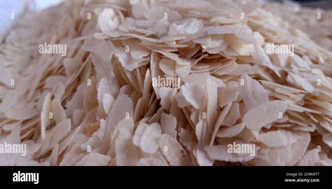 Raw dry Poha presented on closeup picture for branding promotion Stock ...