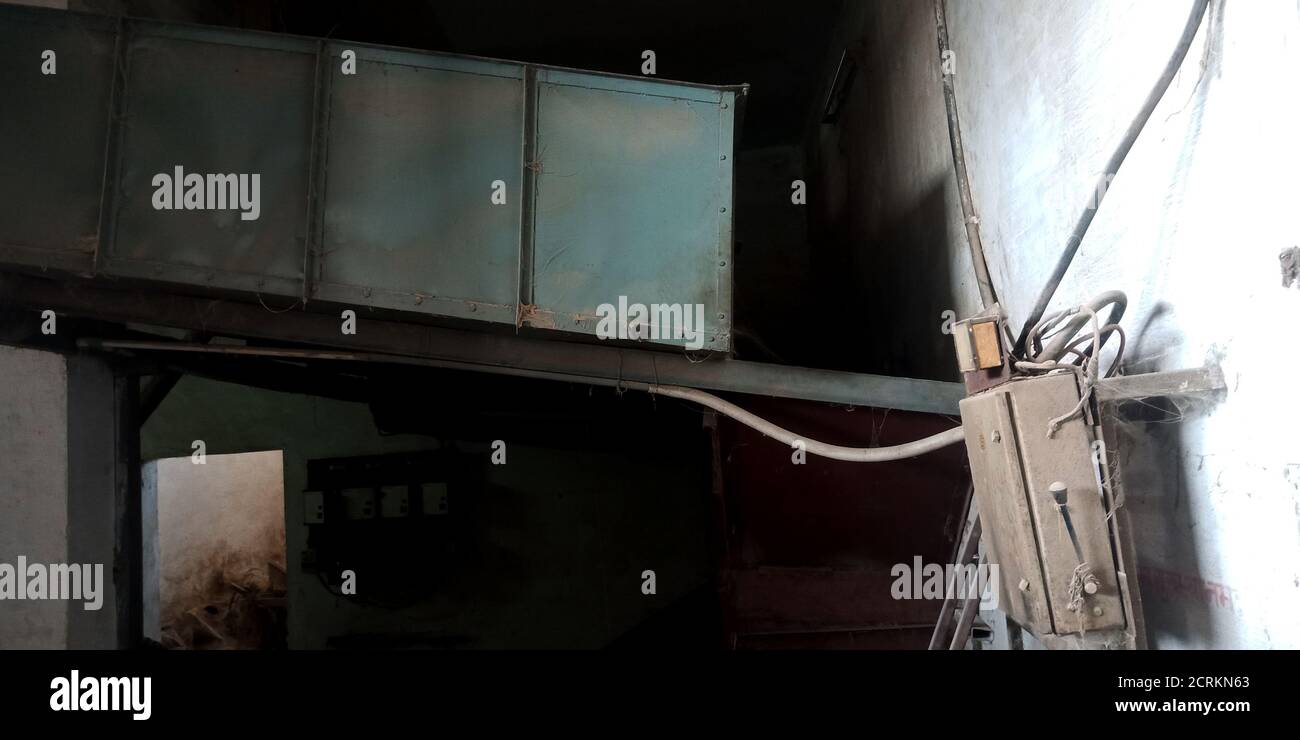 an old rusty rice mill electric supply box tool exposed to the rice ...