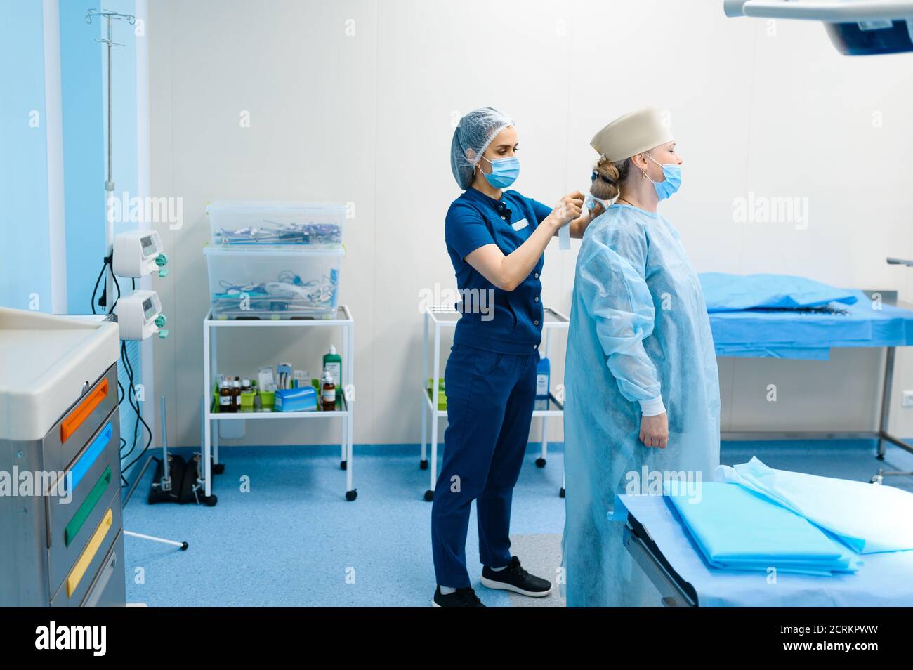 Female surgeon and assistant in operating room Stock Photo - Alamy
