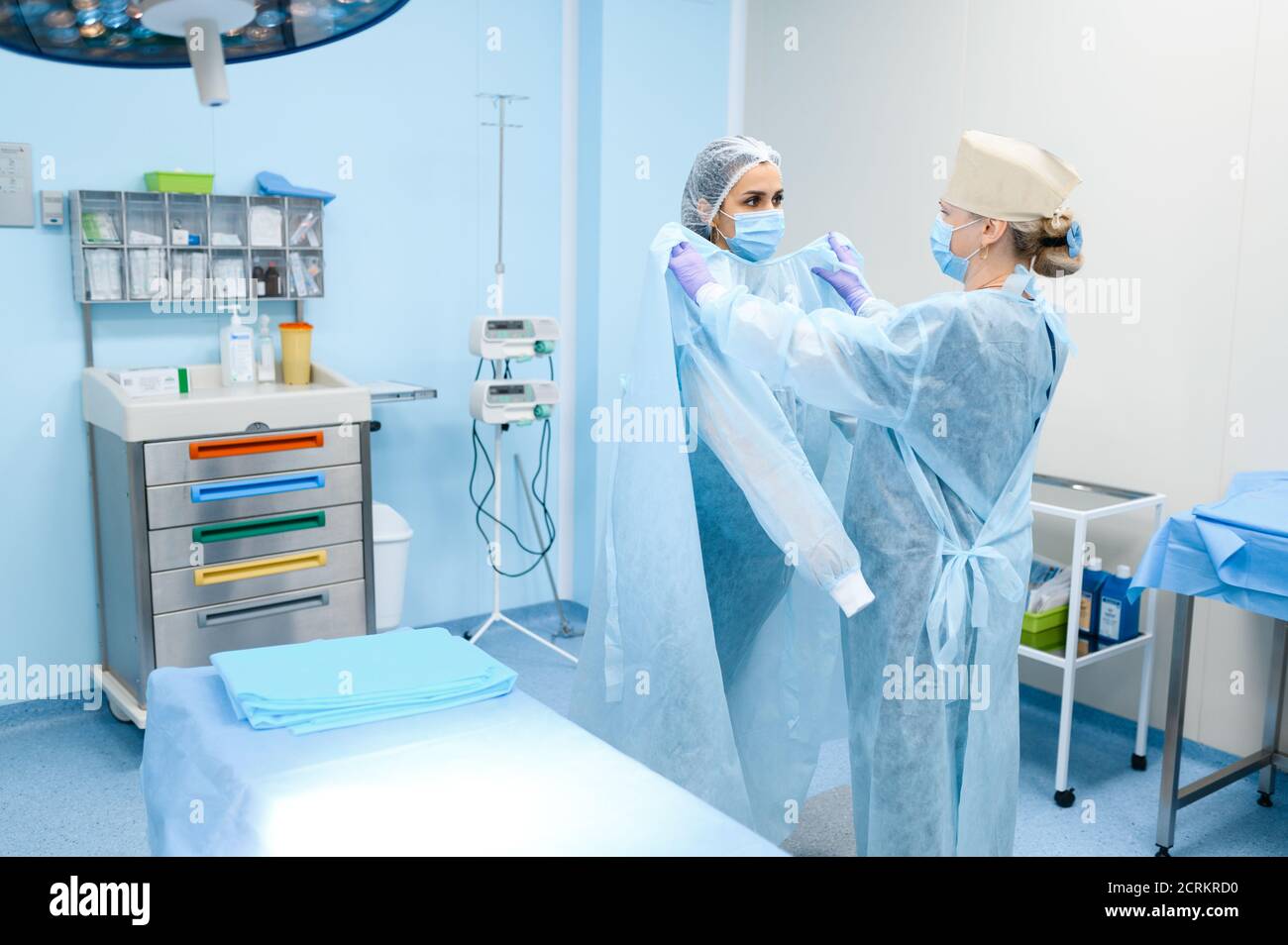Female surgeon and assistant in operating room Stock Photo - Alamy