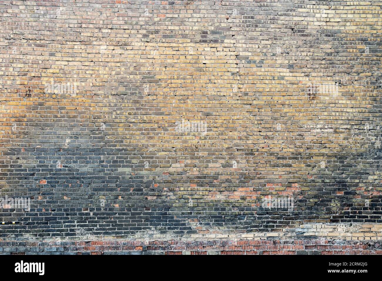 Weathered stained old brick wall background on surface Stock Photo - Alamy