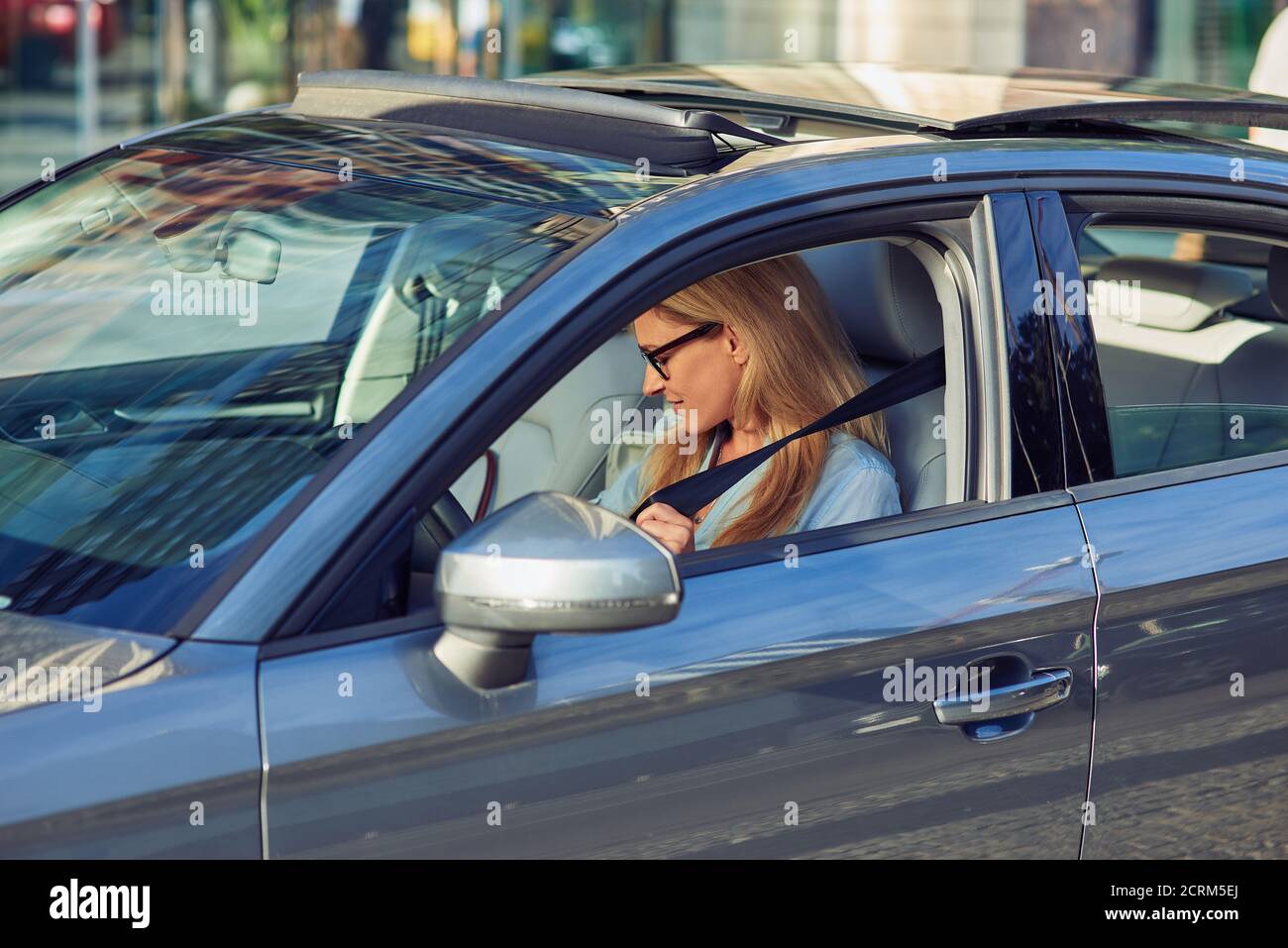 Before you drive away. Beautiful caucasian woman, business lady sitting ...