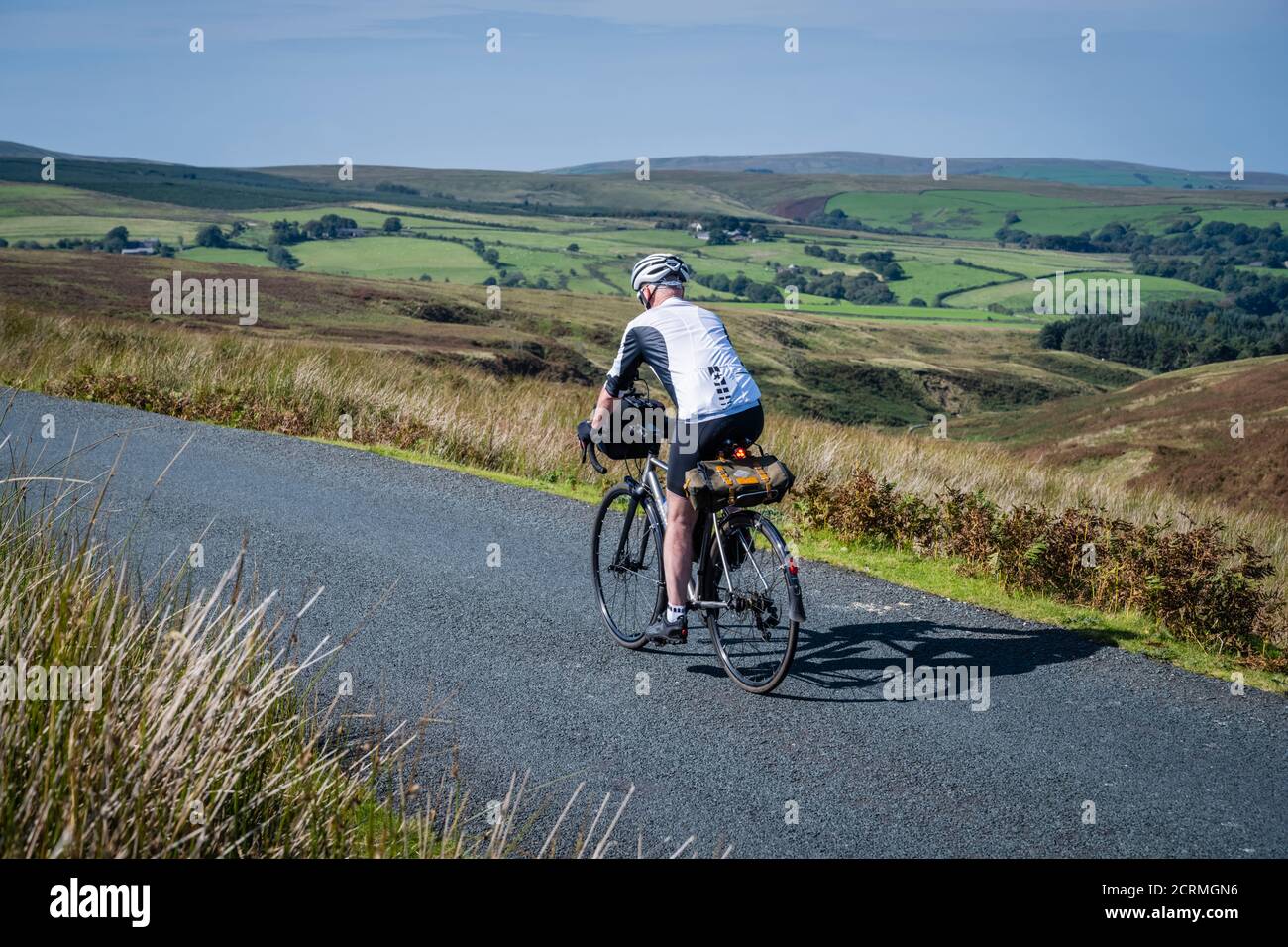 Male cyclist riding over Tatham Fell between Bentham and Slaidburn, on ...