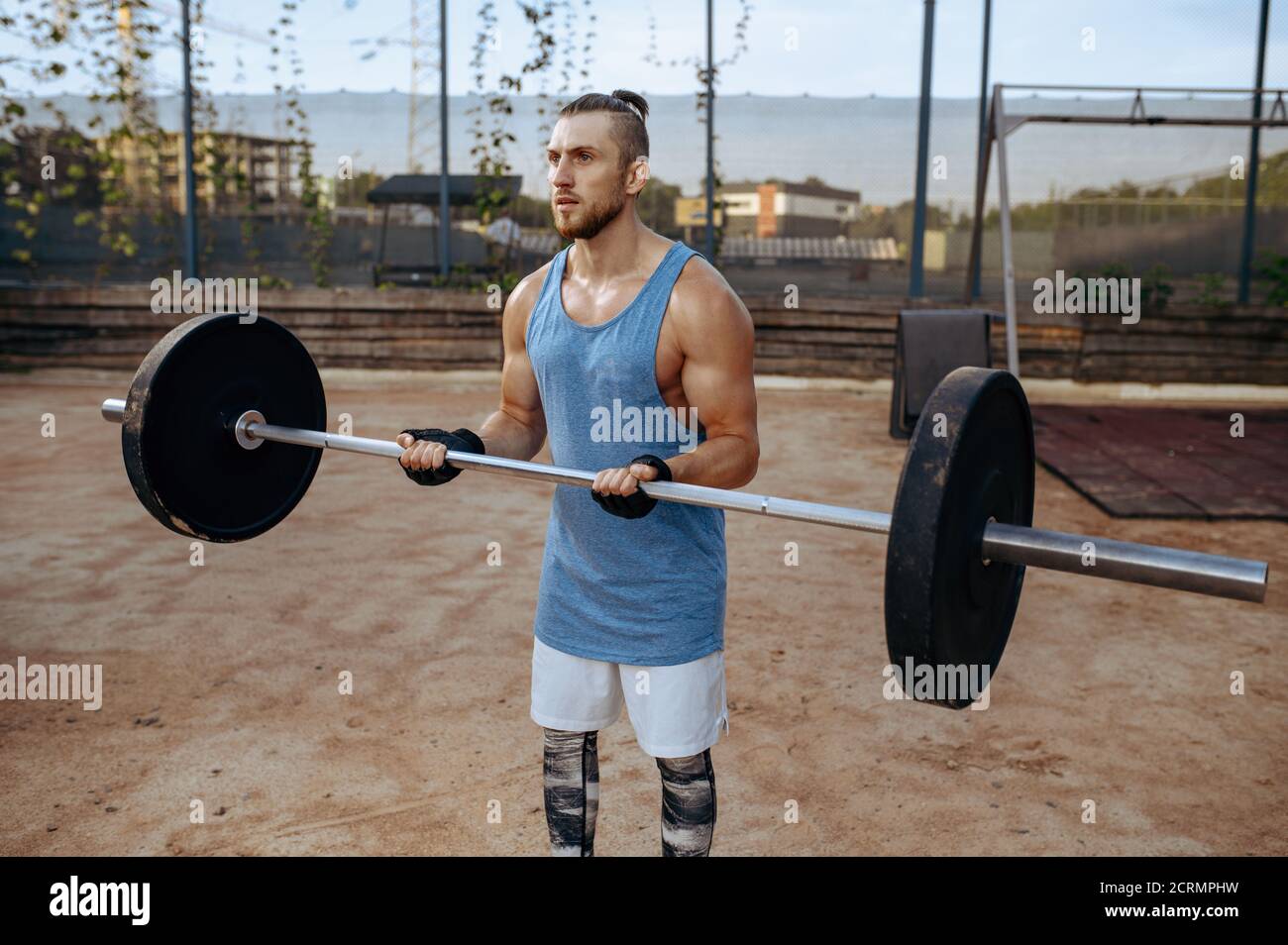 Young man strongman exercise hi-res stock photography and images - Alamy