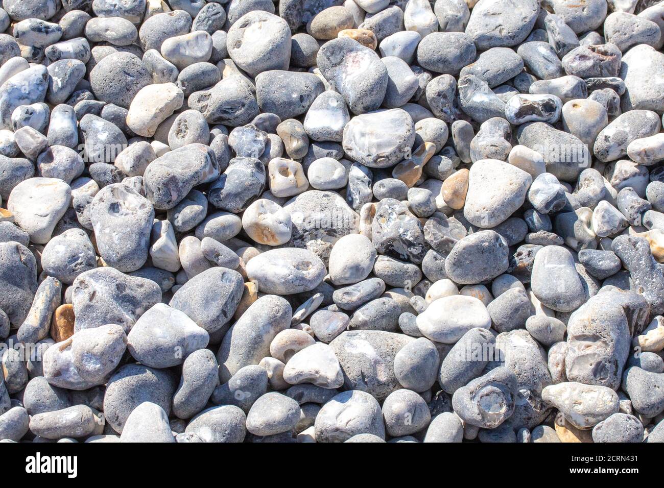 pile of pebbles on a beach Stock Photo - Alamy