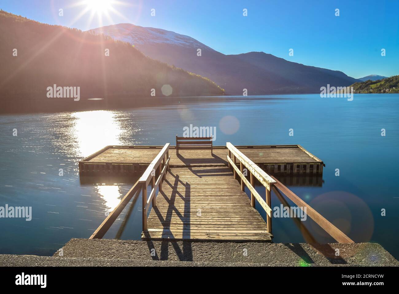 Norwegian landscape, bench on the pier, view of the lake and mountains ...
