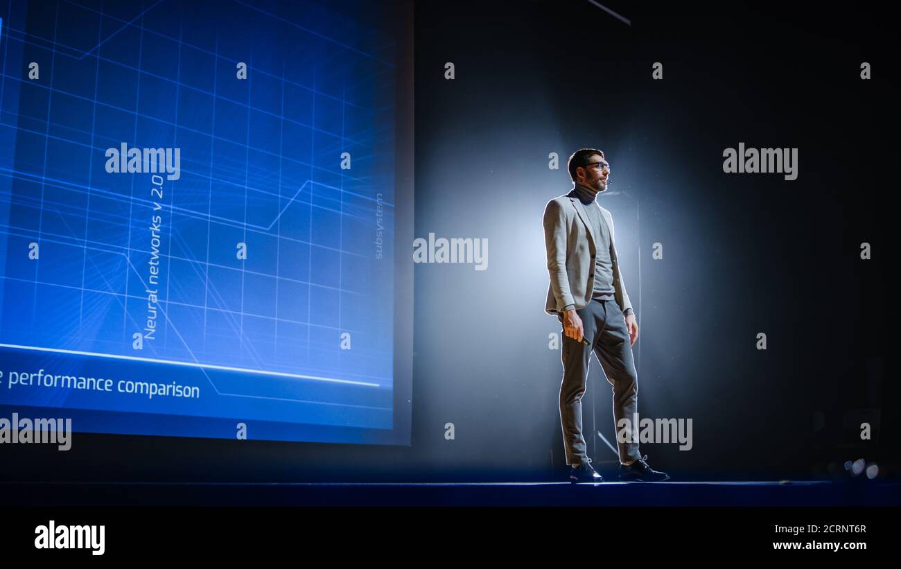 On-Stage Speaker Does Presentation of Technological Device, Shows ...