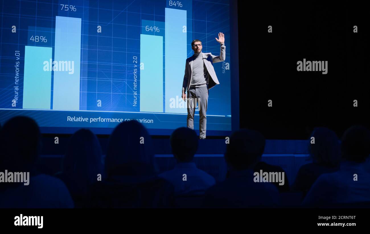 On-Stage Speaker Greets Audience, Presents Technology Product, Uses ...