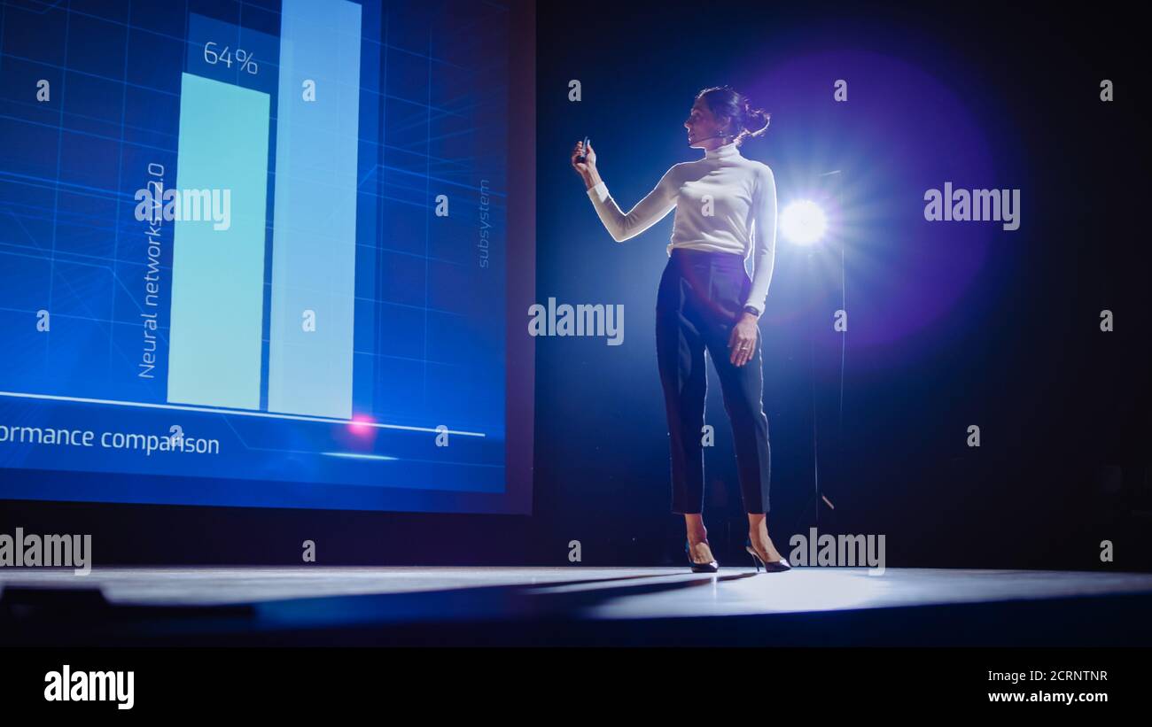 On-Stage Successful Female Speaker Presents Technological Product, Uses ...