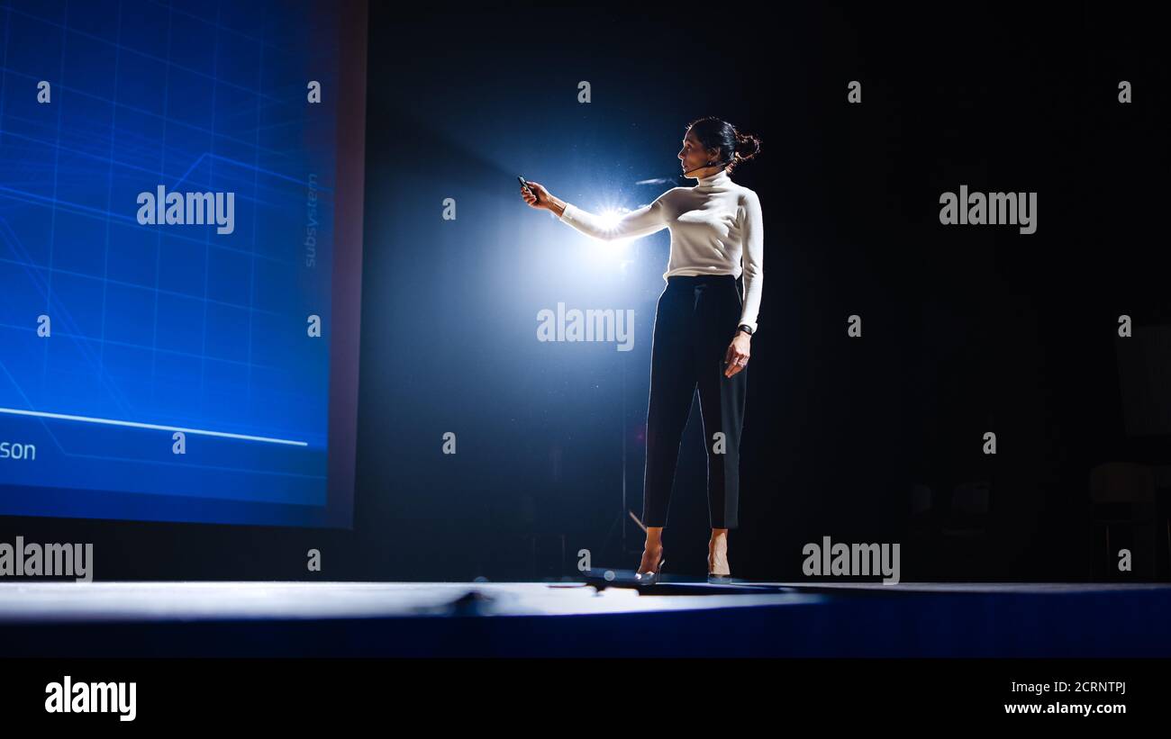 On-Stage Successful Female Speaker Presents Technological Product, Uses ...