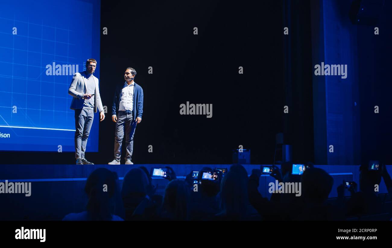 Startup CEO and Chief Developer Stand on Stage and Present New Product ...