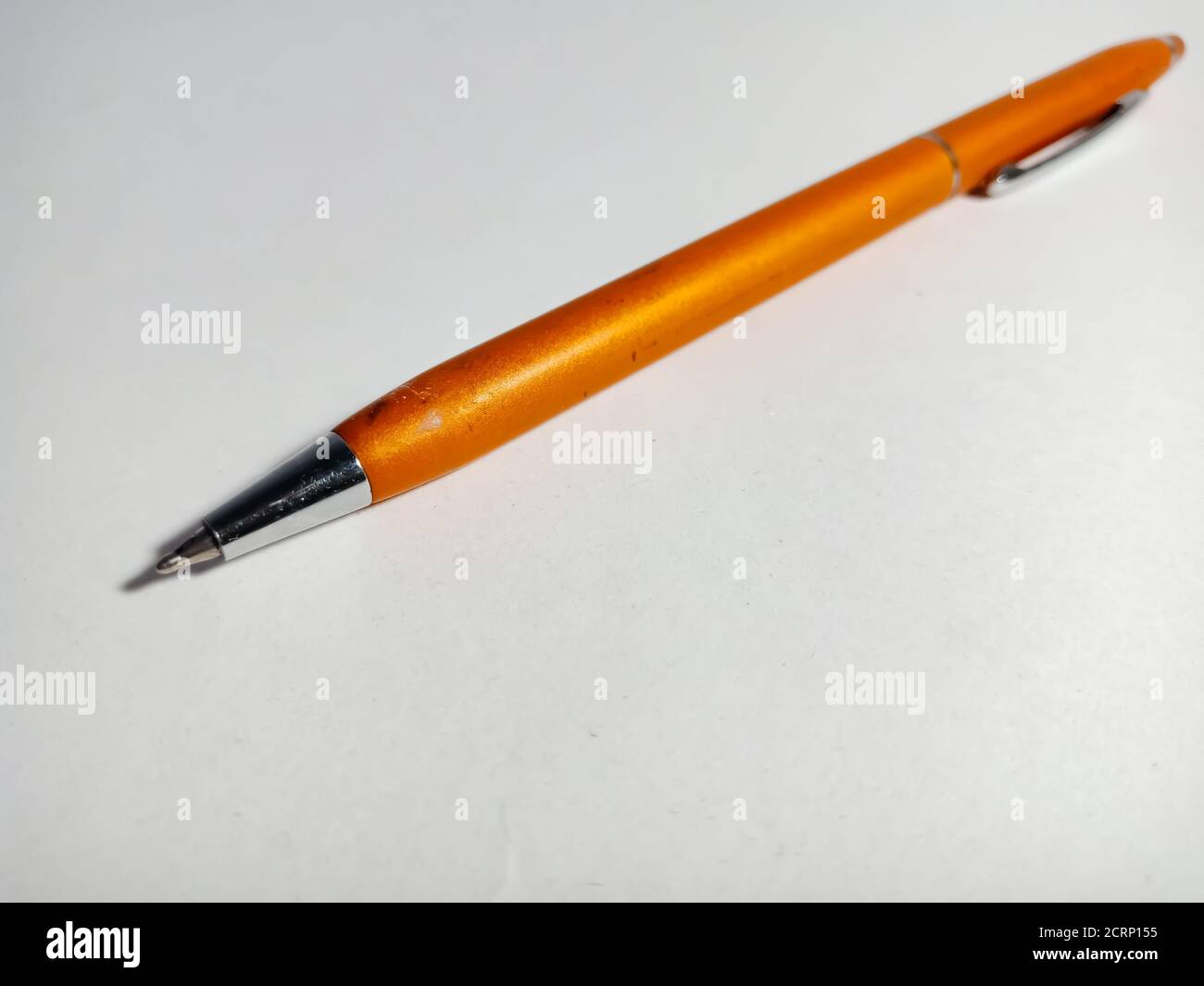 Orange color pen isolated on white background for marketing and ...