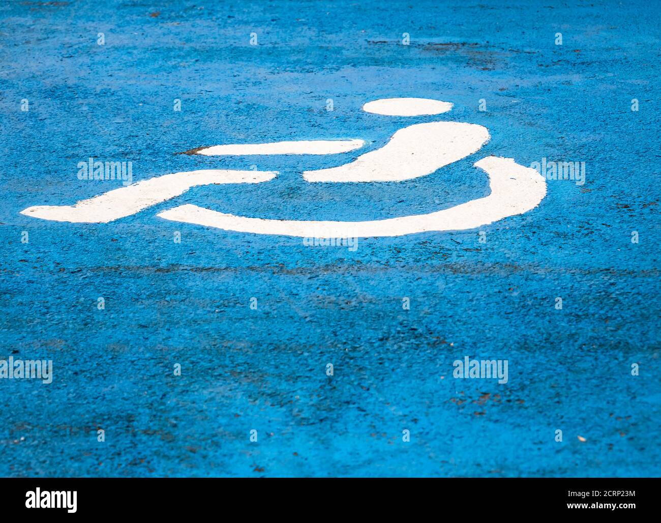 Only handicap parking space sign painted on the ground with white paint ...