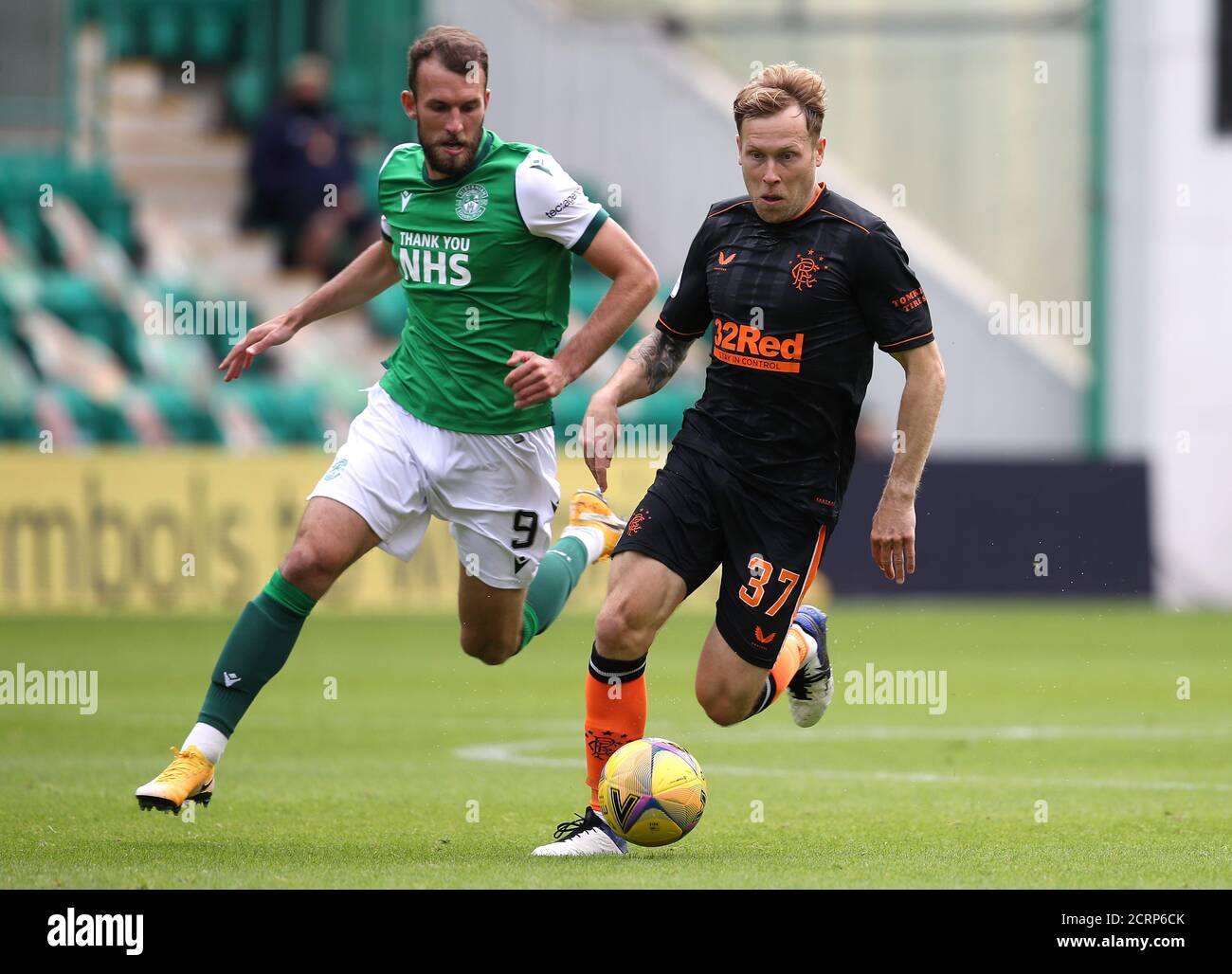 Hibernian's Christian Doidge (left) and Rangers' Scott Arfield battle ...