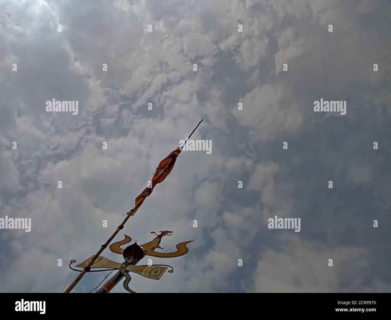 Lord shiva trident with religious hindu flag displayed on blue sky ...