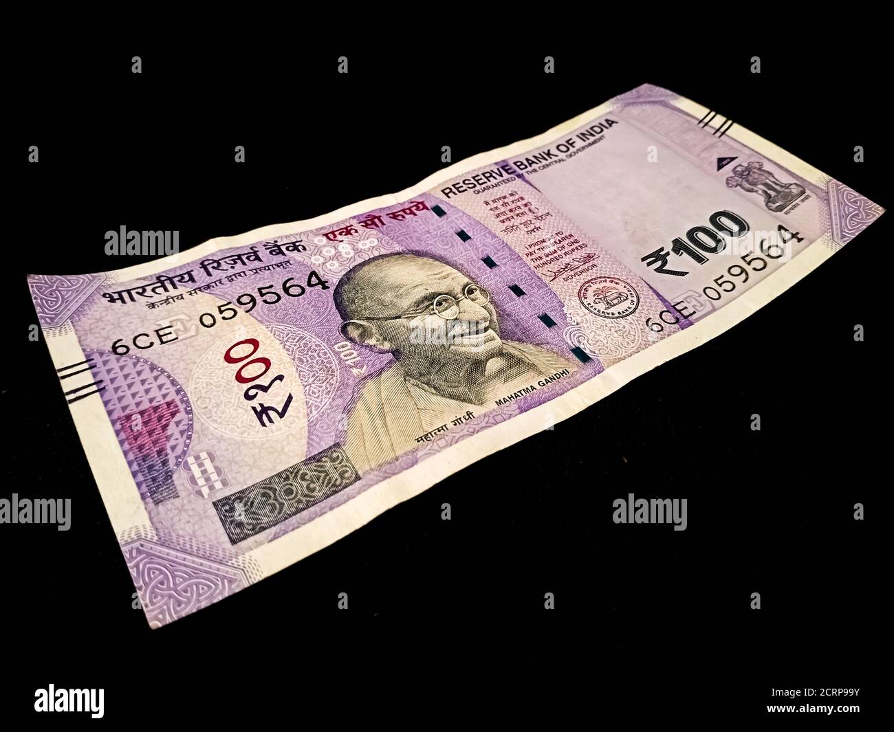 Indian currency one hundred 100 rupees note isolated on black ...